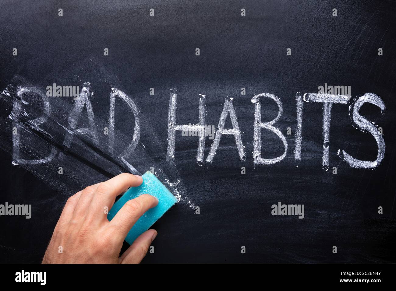 Person Removing Word Bad With Sponge From Bad Habits Stock Photo - Alamy
