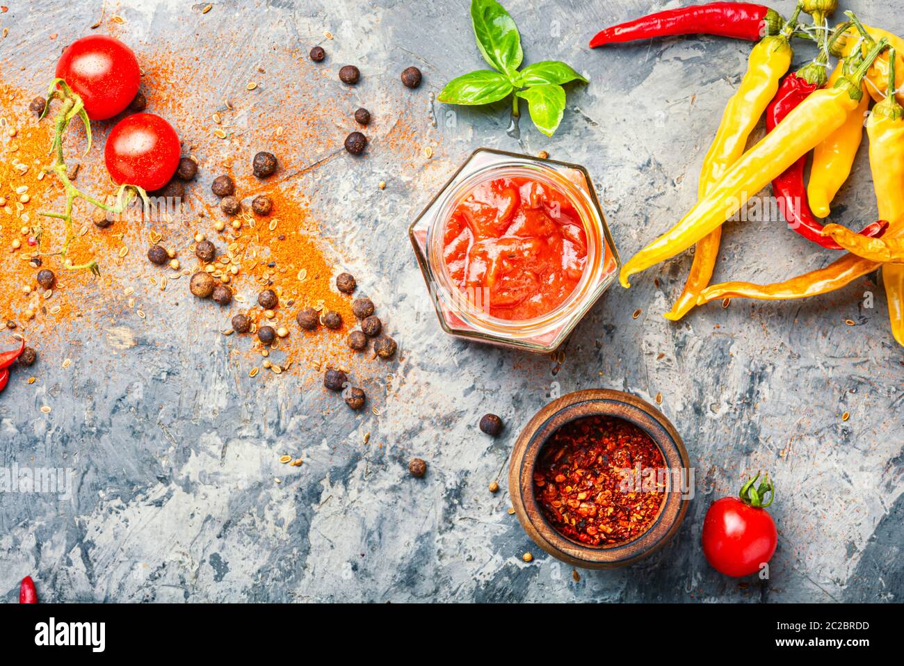 Spicy hot chili sauce with of chilli pepper Stock Photo - Alamy