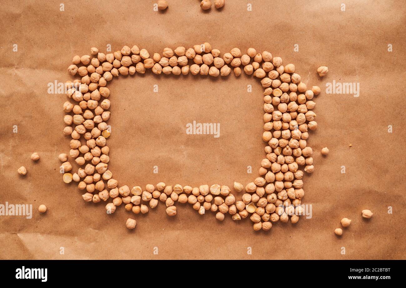 chickpea beans lie in the shape of rectangle on a brown paper ...