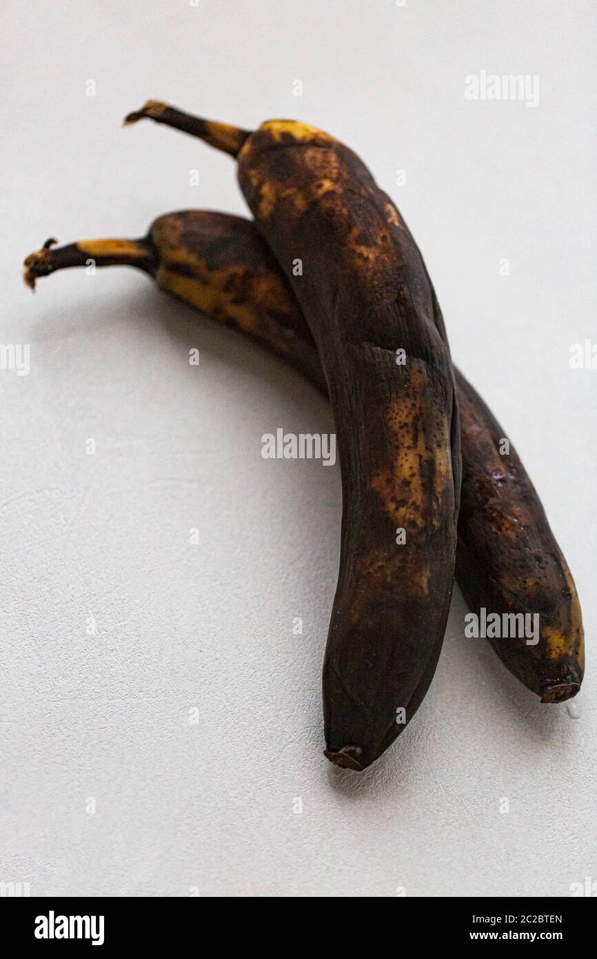 Dried unhealthy banana on white background. Trendy spoiled organic ...