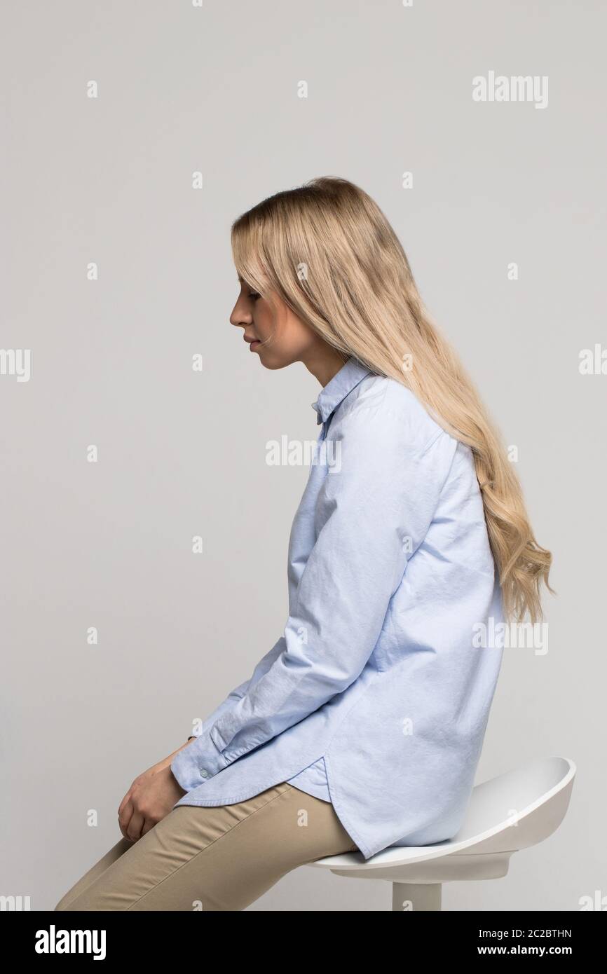 Closeup portrait of young Caucasian woman with scoliosis, side view ... Closeup portrait of young Caucasian woman with scoliosis, side view ...