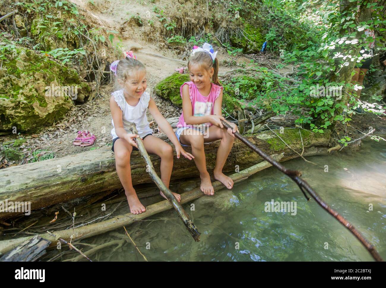 Happy barefoot children fun in nature at forest on summer day Stock ...