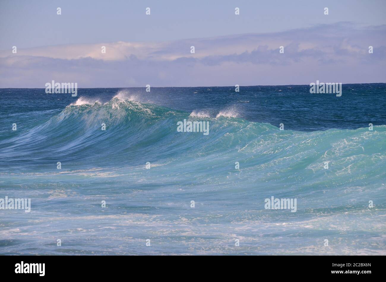 Big Blue Wave Breaks in the Atlantic Ocean Stock Photo - Alamy
