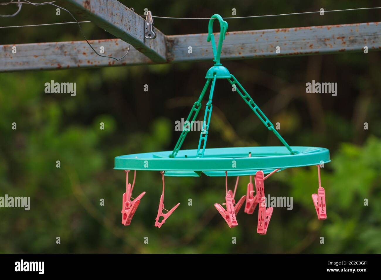 clothes pins on a washing line close up Stock Photo - Alamy