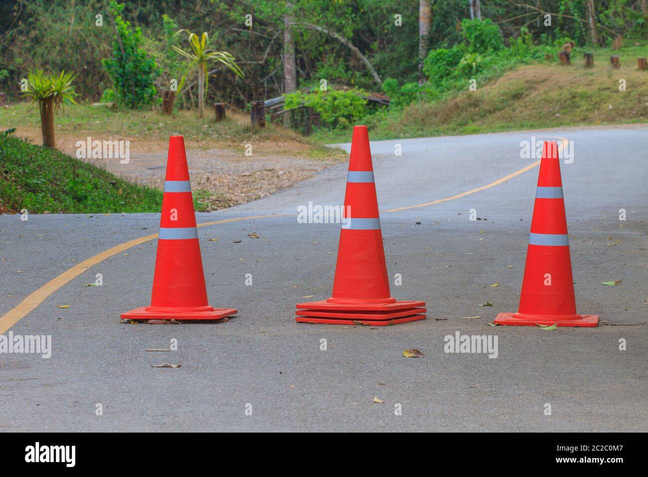 traffic warning cone on road in parking area Stock Photo - Alamy
