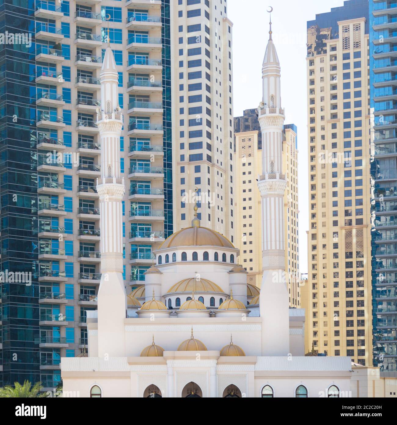 Muslim mosque among modern buildings Stock Photo - Alamy
