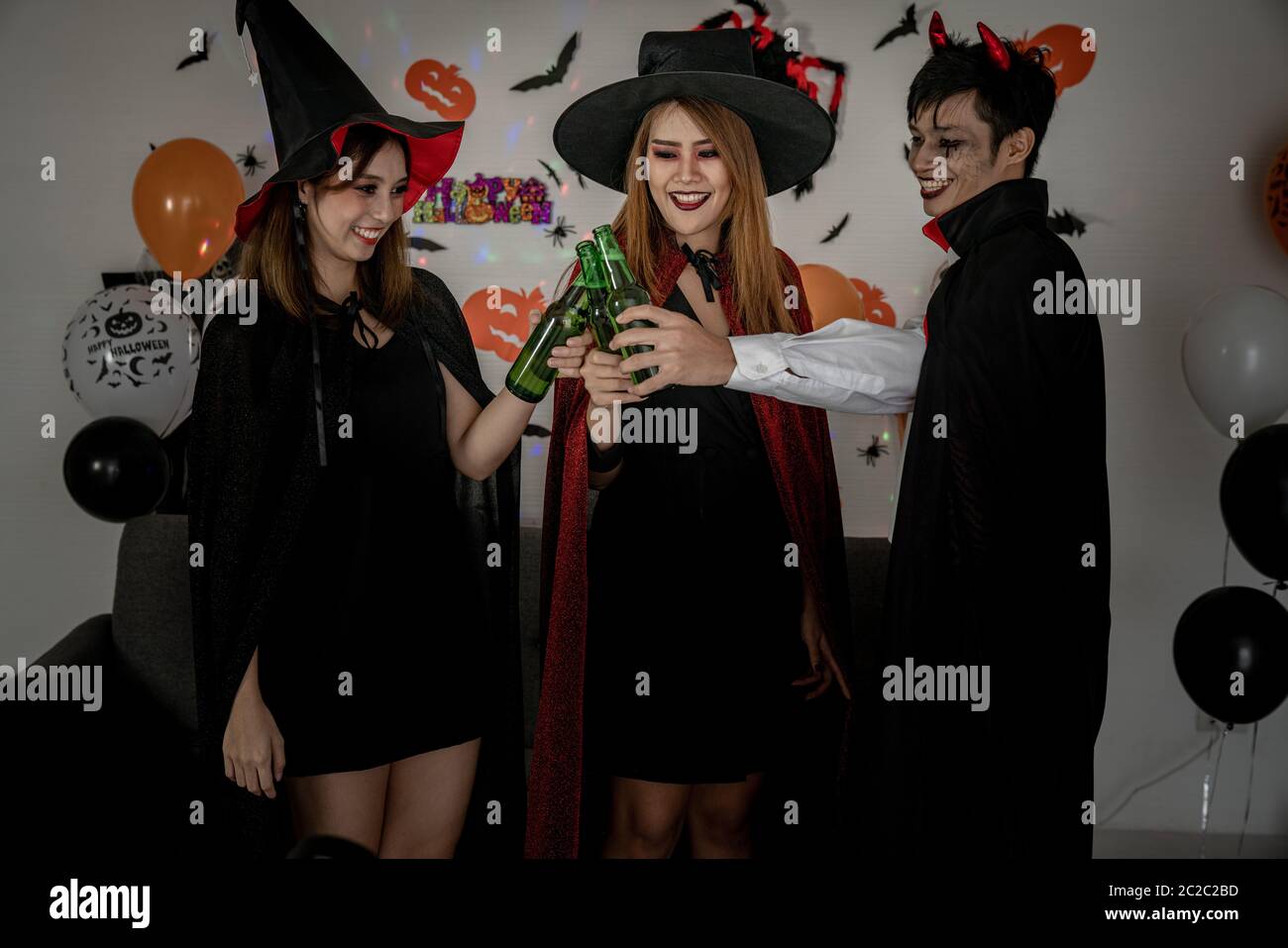 Group of young adult and teenager people celebrating a Halloween party ...