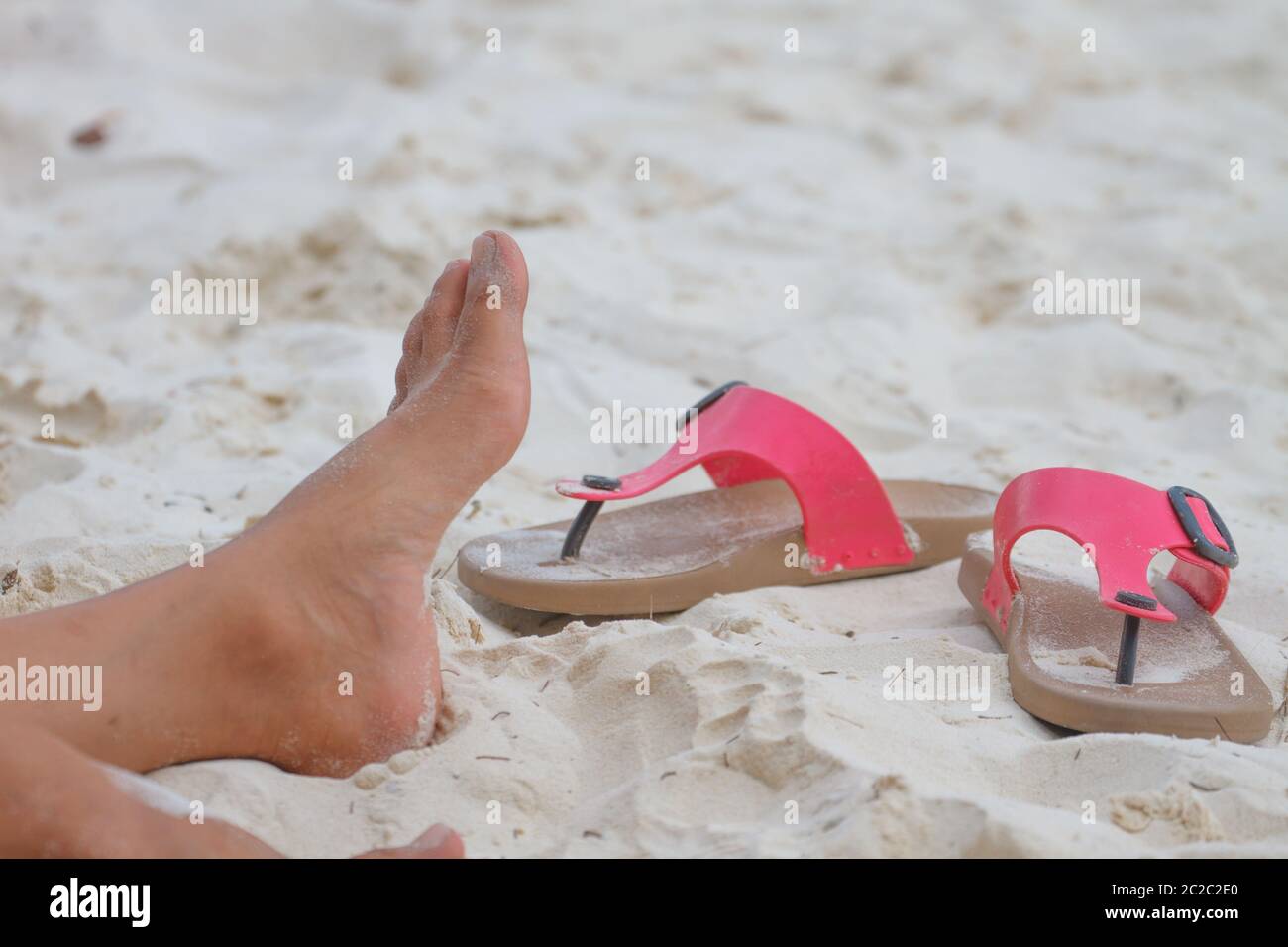 Beach shoes sandal in sand hi-res stock photography and images - Alamy