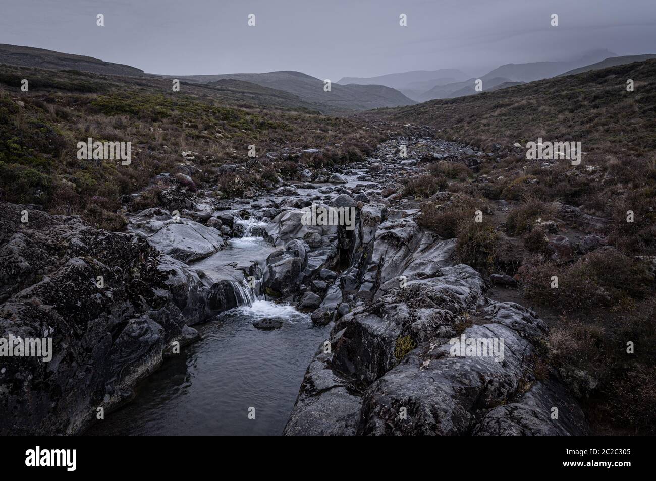 A gloomy and moody scene under overcast and wet weather in Tongariro ...