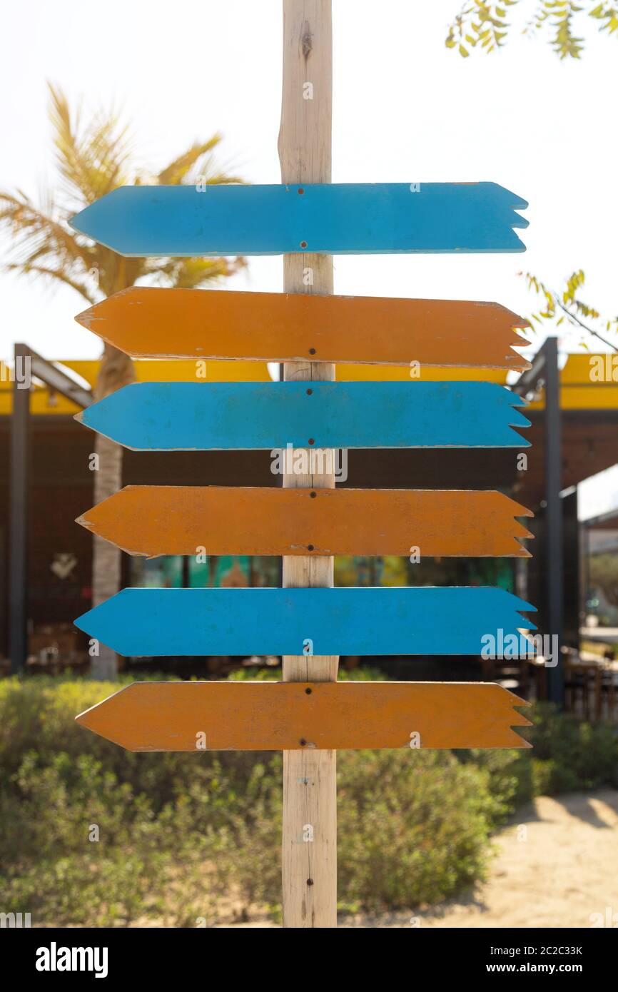 Direction signs on a wooden post Stock Photo - Alamy