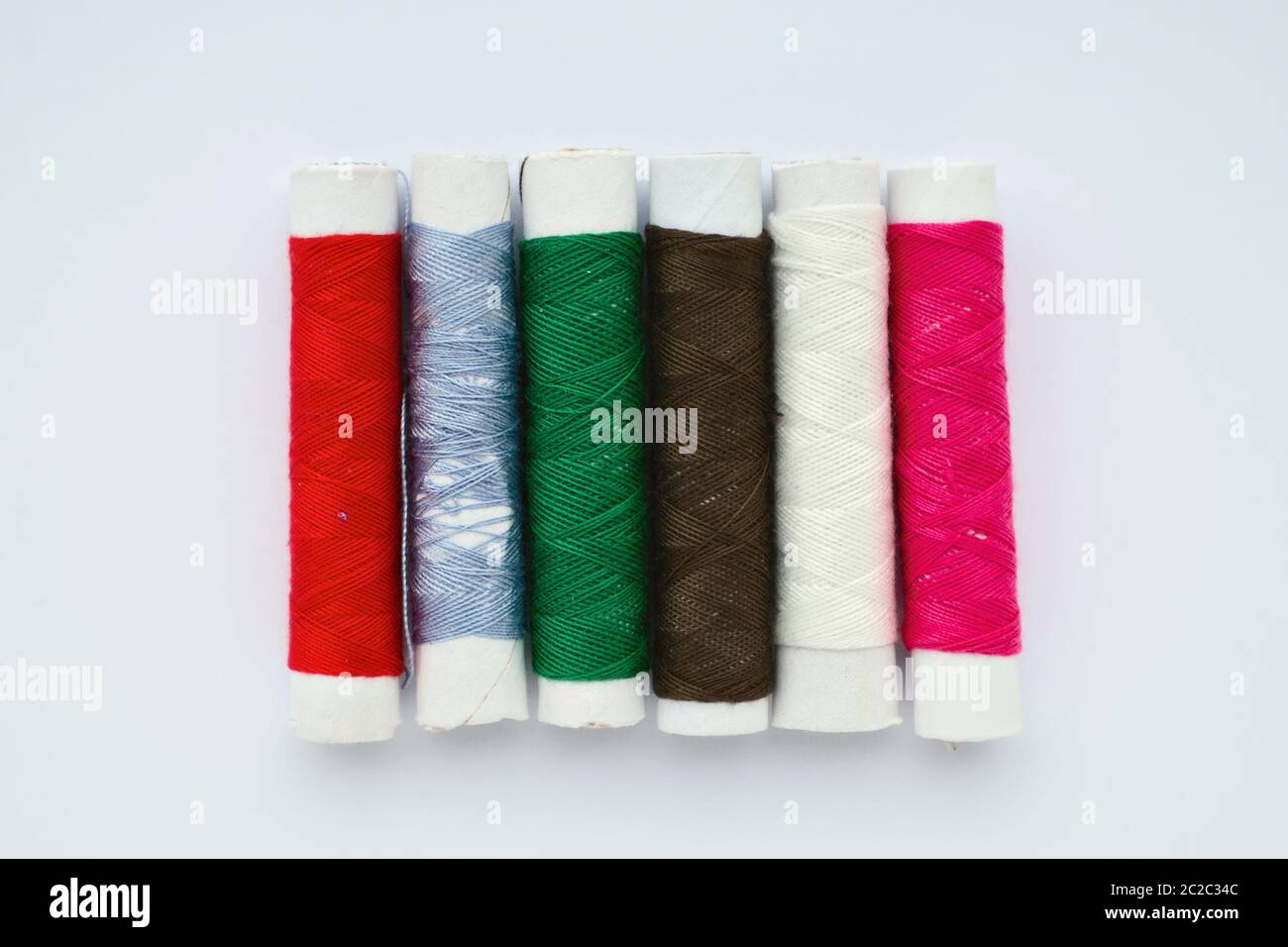 Green white red threads hi-res stock photography and images - Alamy