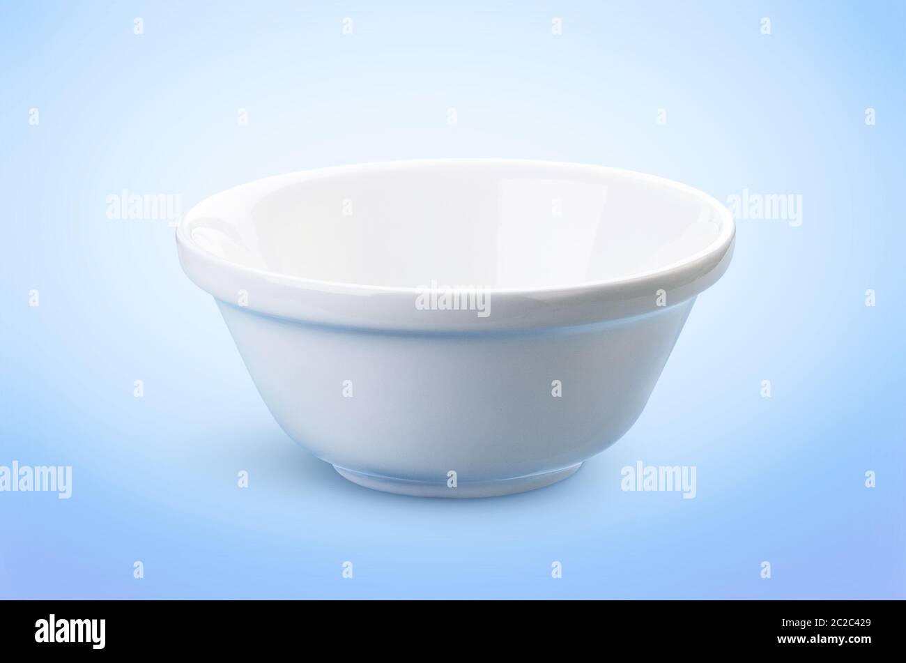 Empty white bowl isolated on blue background, ideal for the ...