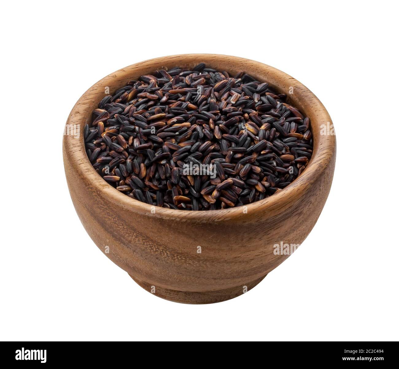 Black rice groats in wooden bowl isolated on white background Stock ...