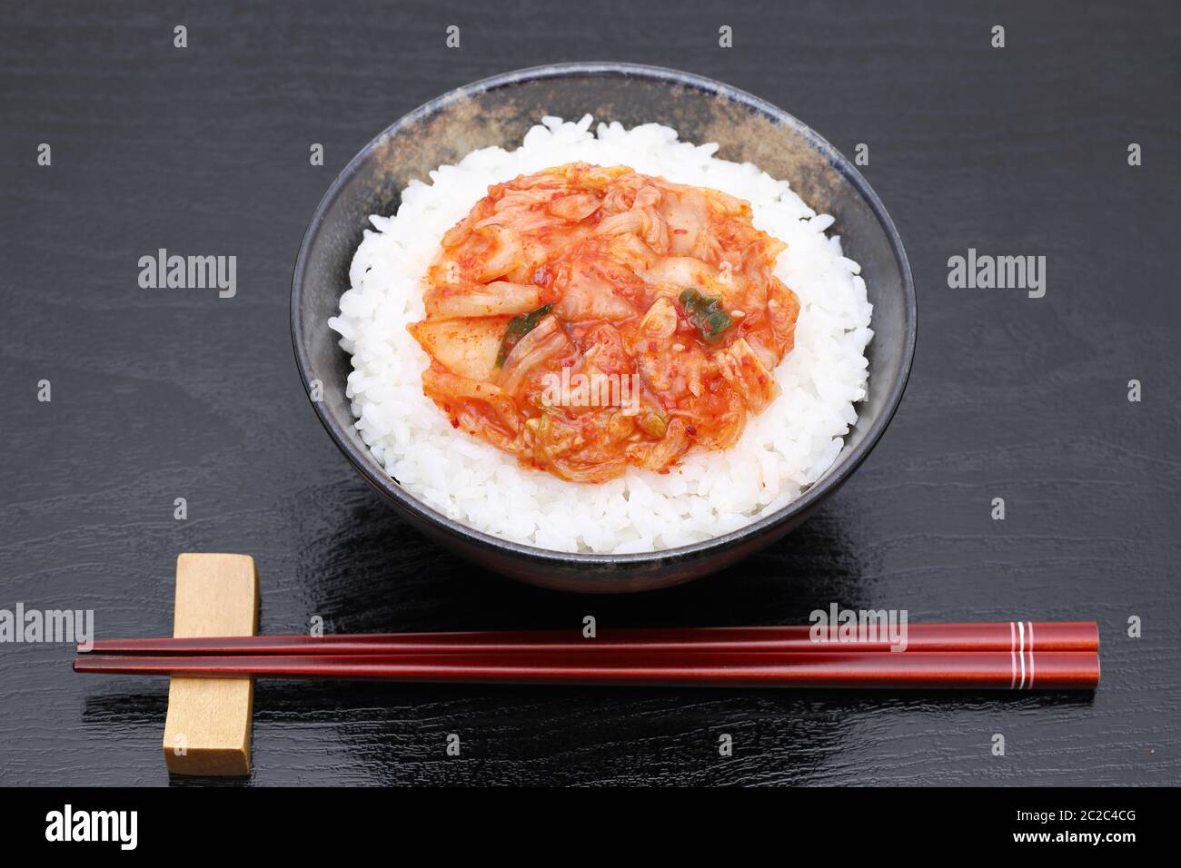 Korean food, cooked white rice with kimchi Stock Photo - Alamy