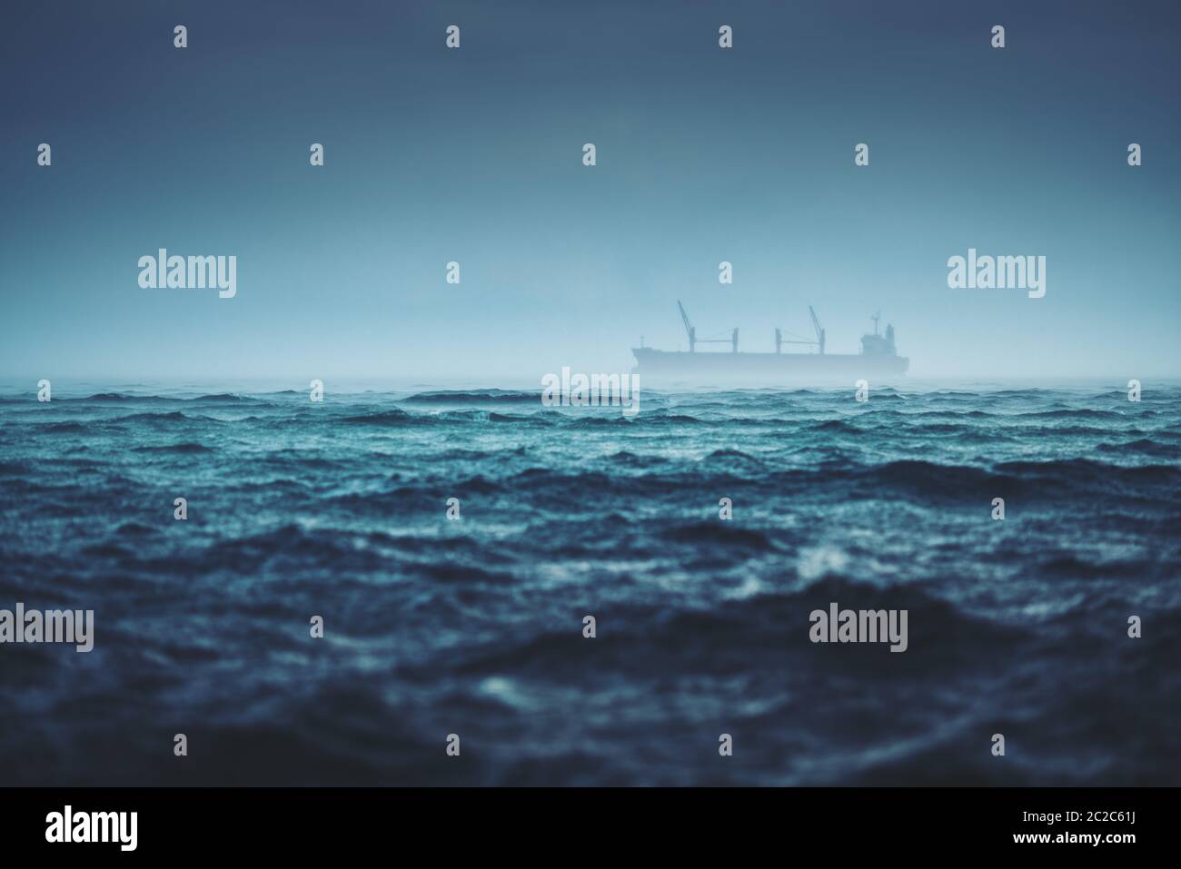 Sea ripple water with rain and ship Stock Photo - Alamy