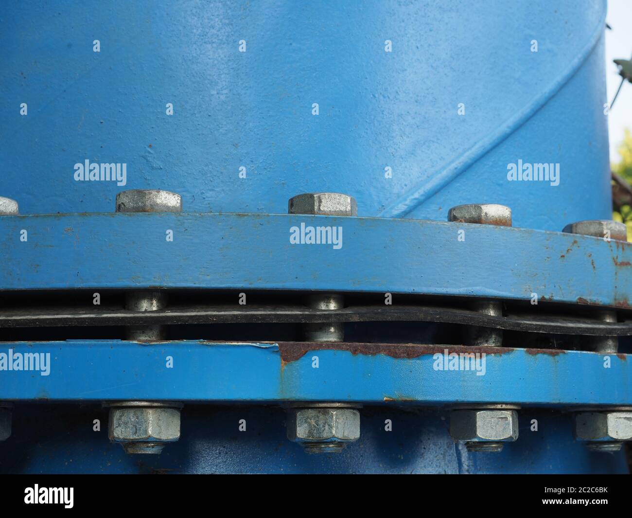big blue steel water pipes with bolts Stock Photo - Alamy