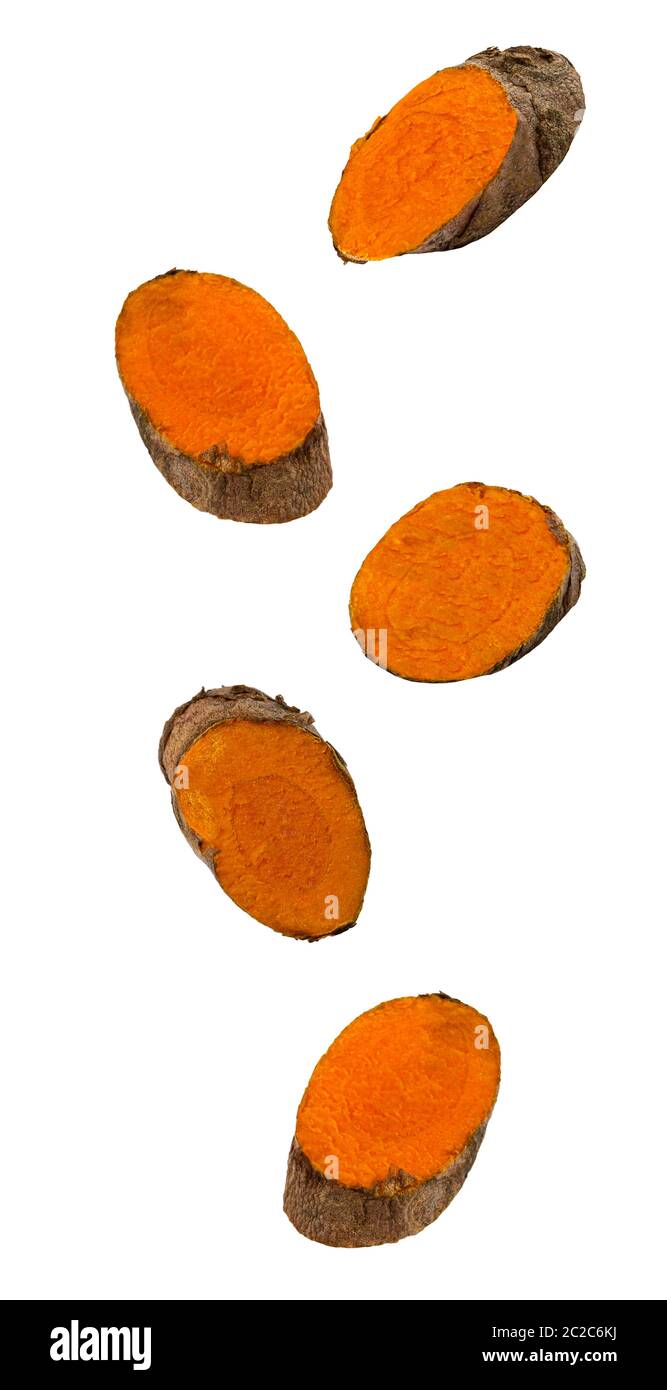 Isolated flying spices. Natural detox effect of turmeric with a sweet ...