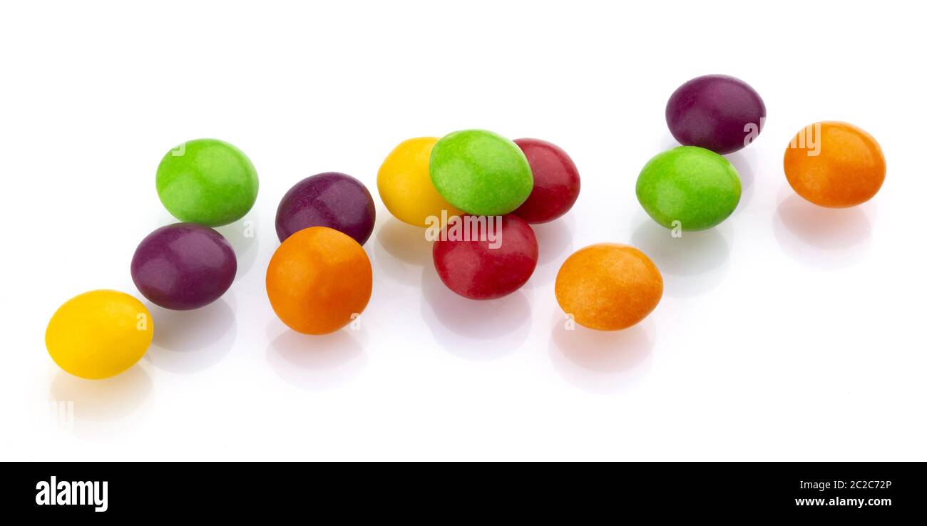 Multicolor shiny nuts and raisins dragee isolated on white background ...