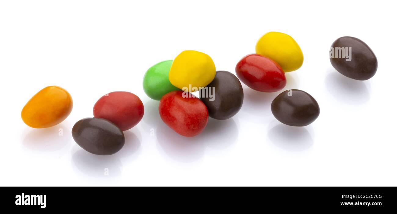 Multicolor shiny nuts and raisins dragee isolated on white background ...