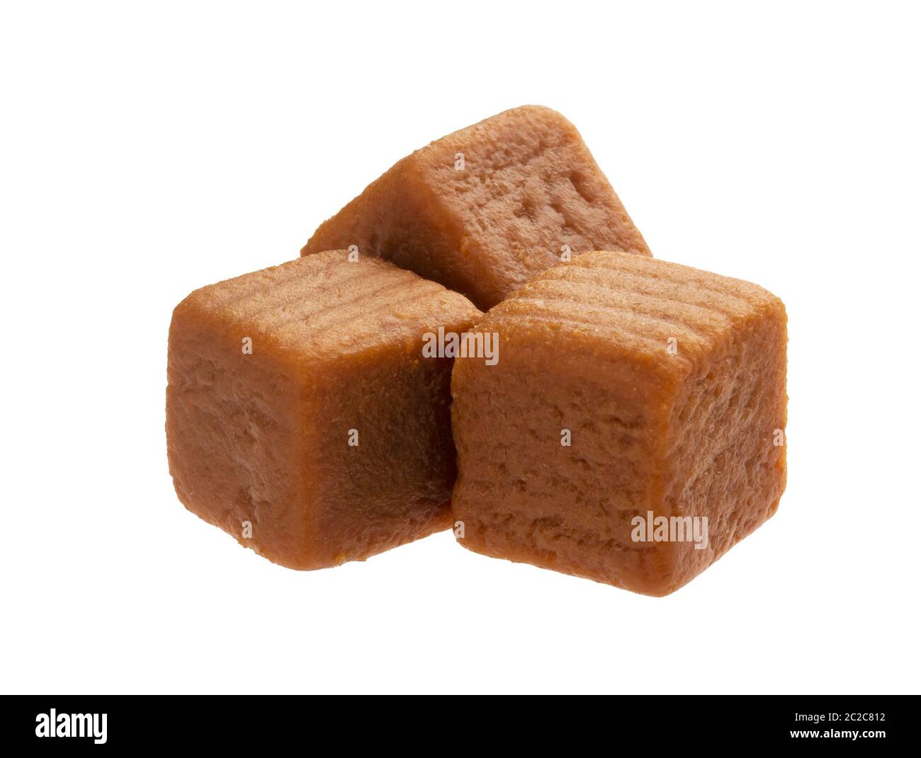 Square caramel candies isolated on white background Stock Photo - Alamy