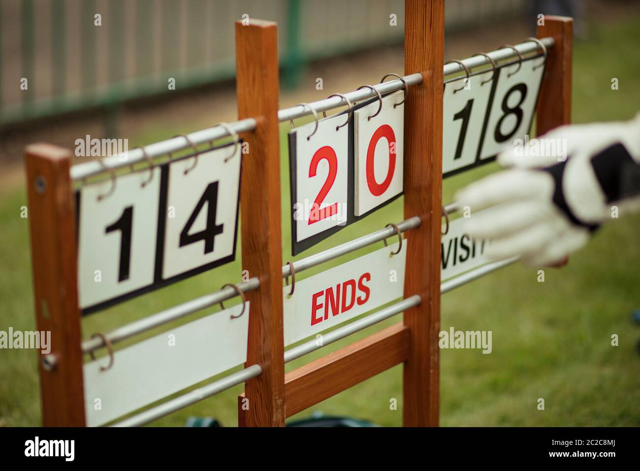 A close up shot of a lawn bowling scoreboard on grass, showing double ...