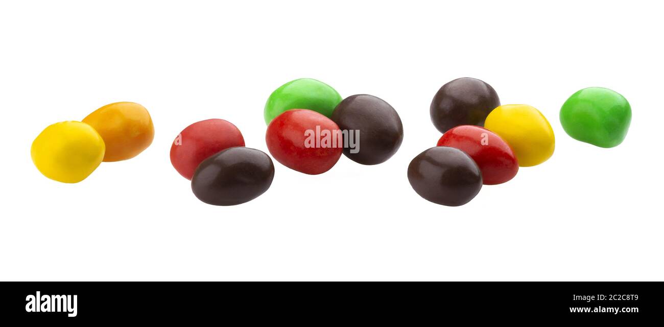 Multicolor shiny nuts and raisins dragee isolated on white background ...