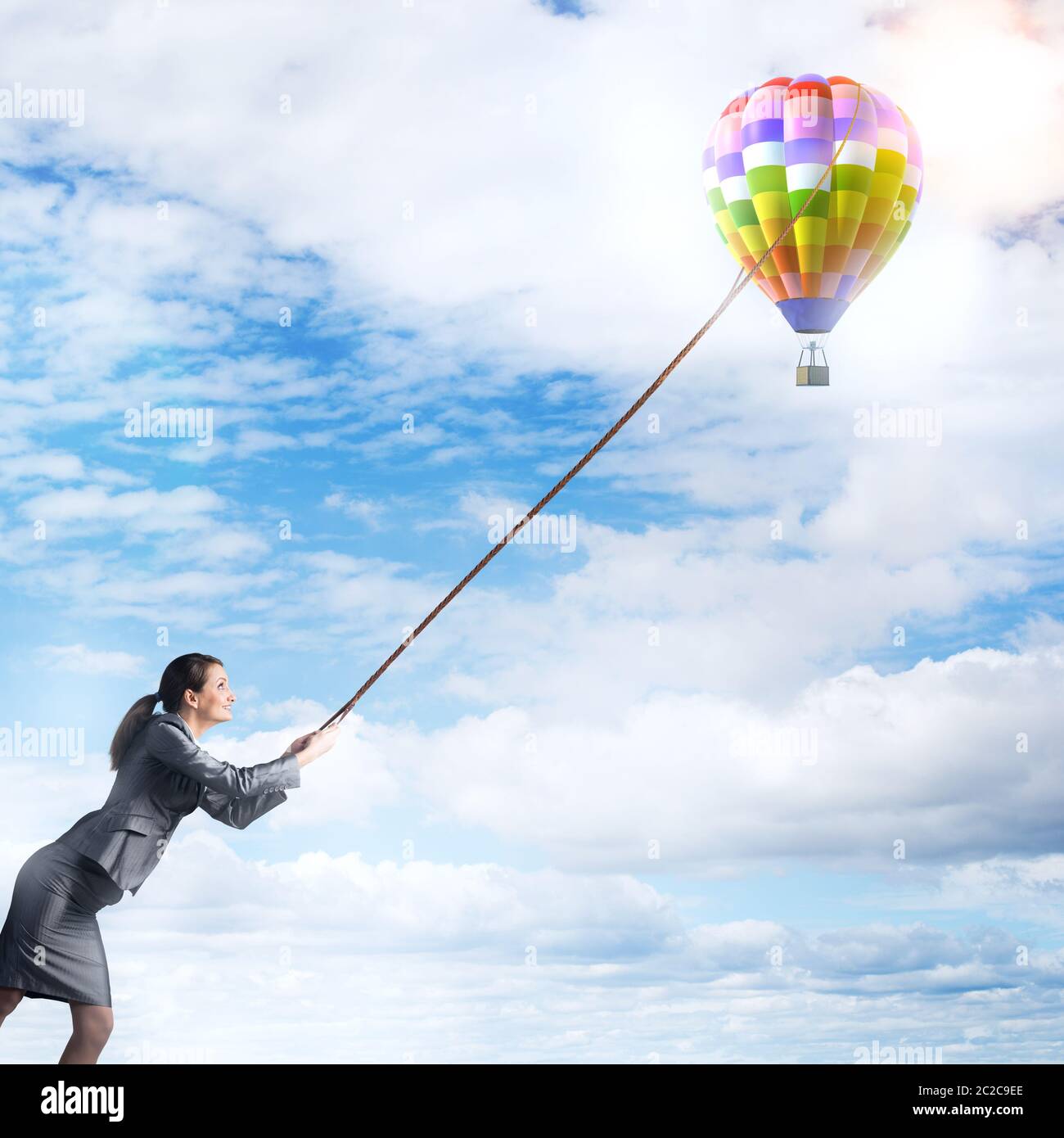 Woman catch balloon Stock Photo - Alamy