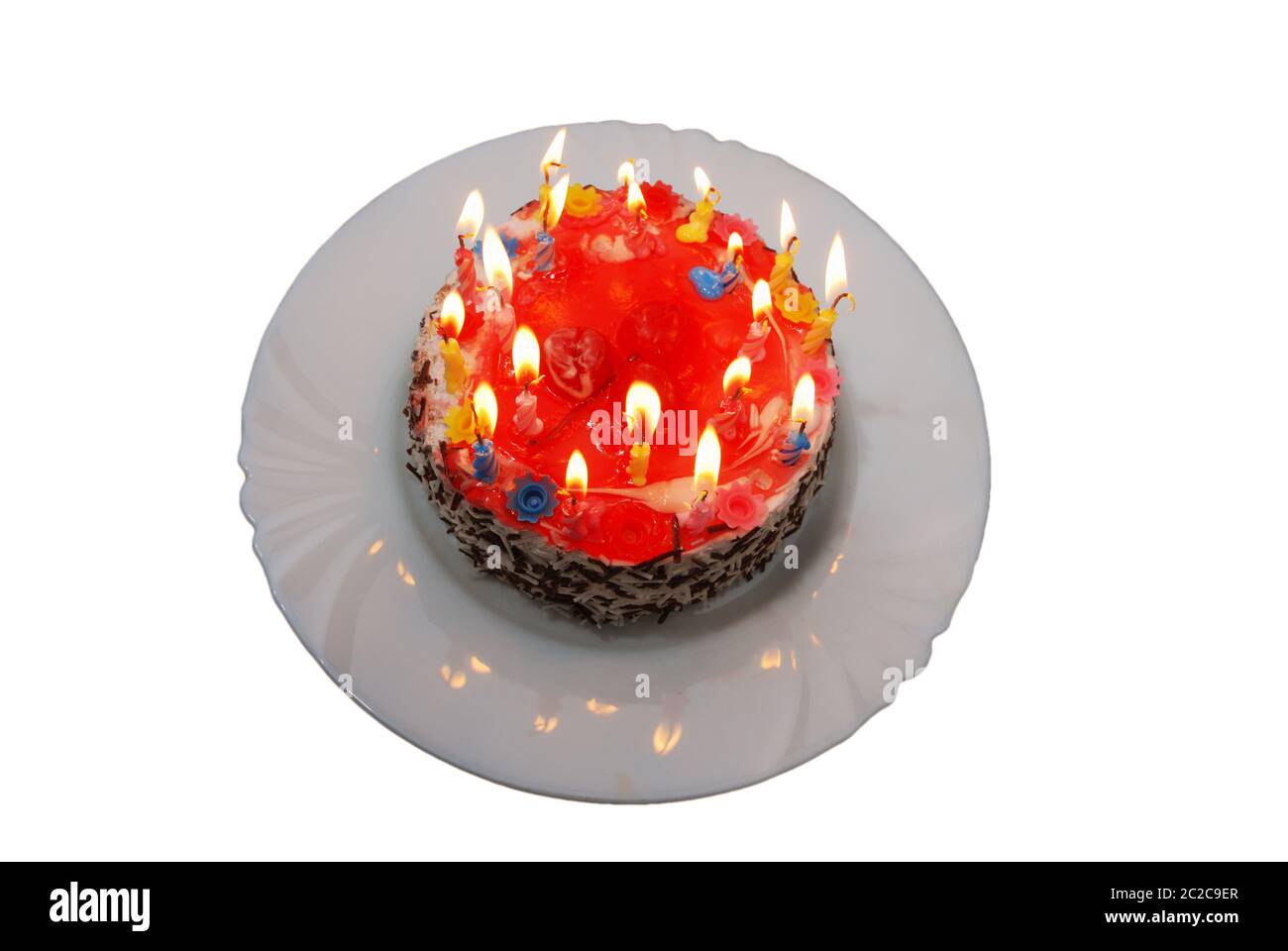 birthday cake with lighted candles on the plate Stock Photo - Alamy