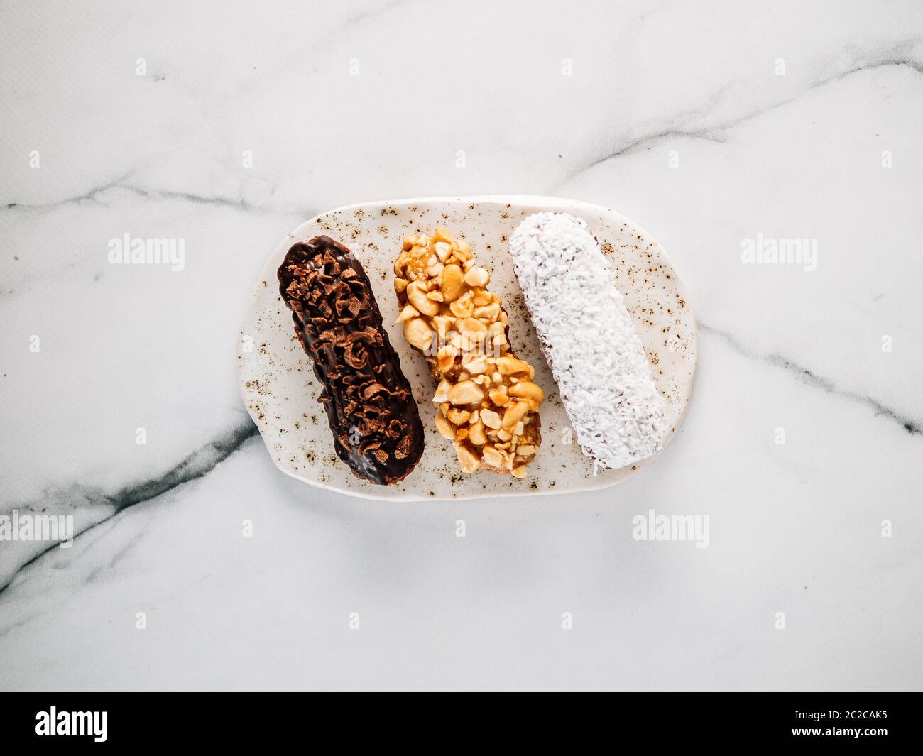 Healthy eclairs or profitroles on marble background Stock Photo - Alamy