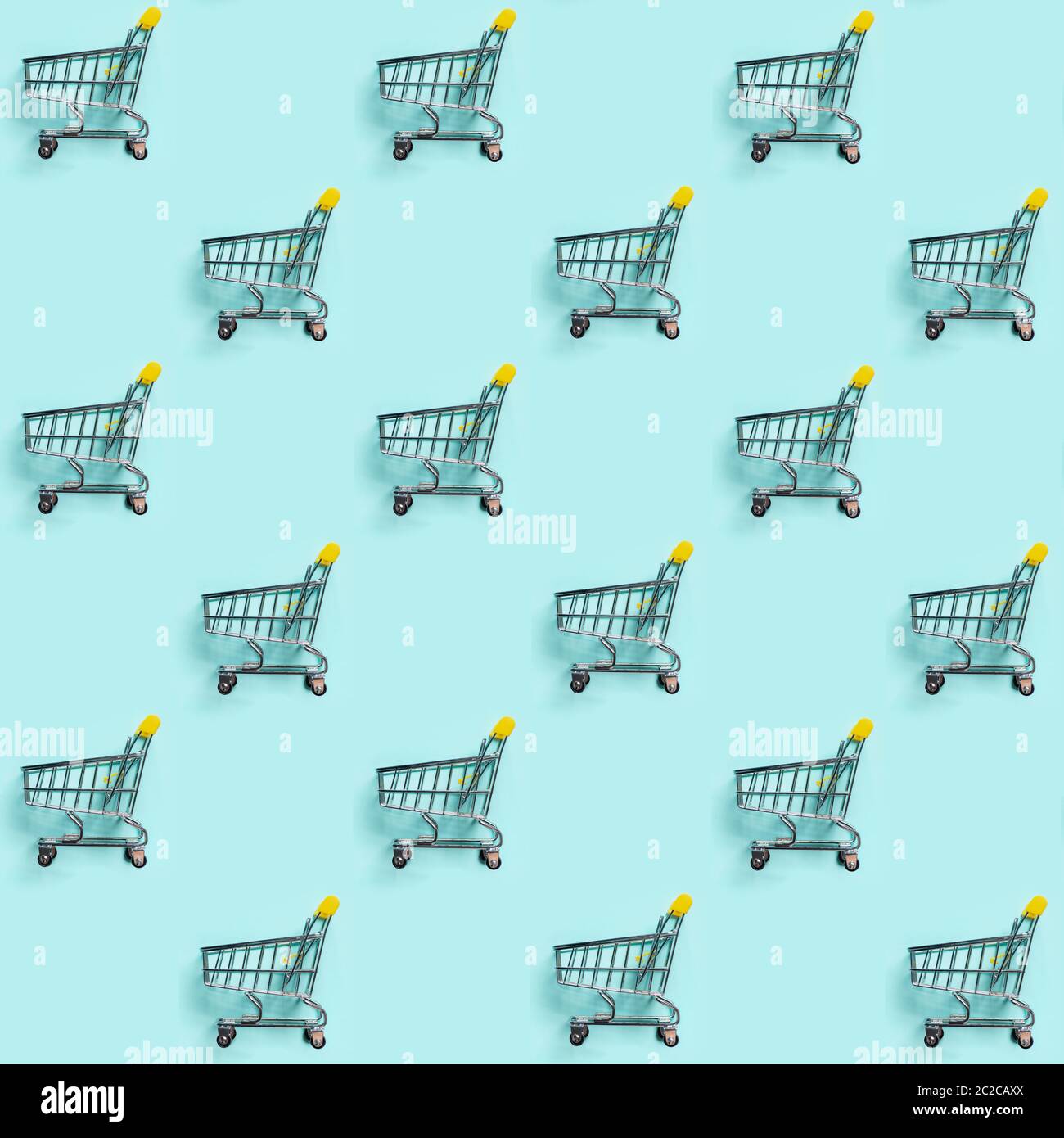 Shopping cart staggered on blue. Seamless pattern Stock Photo - Alamy