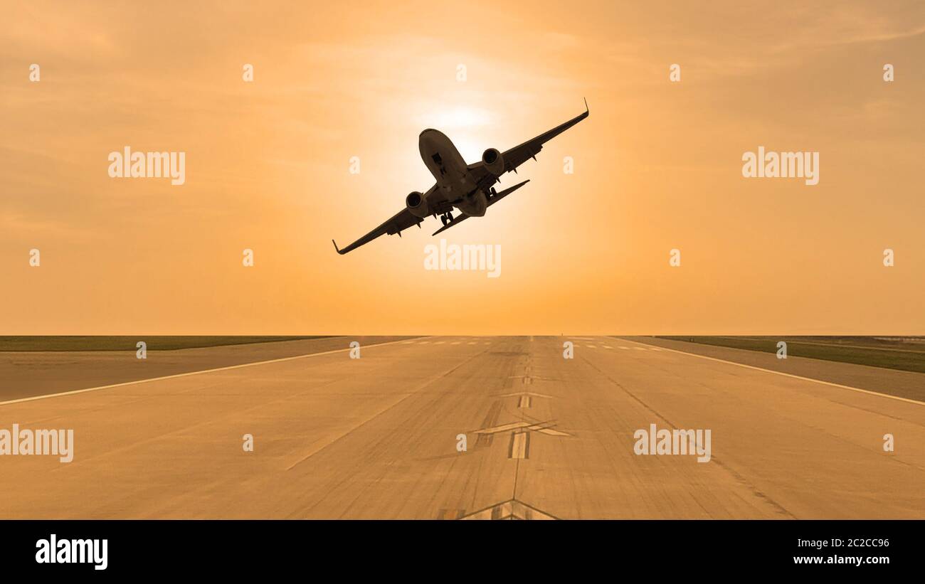 Plane taking off from the runway at sunset day Stock Photo - Alamy