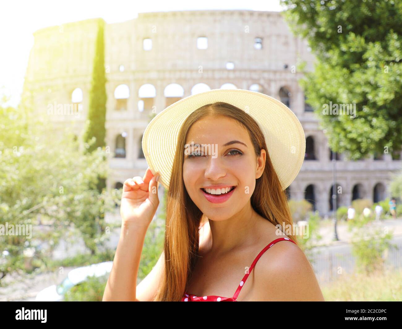 Portrait of smiling beautiful tourist girl in Rome with Colosseum on ...