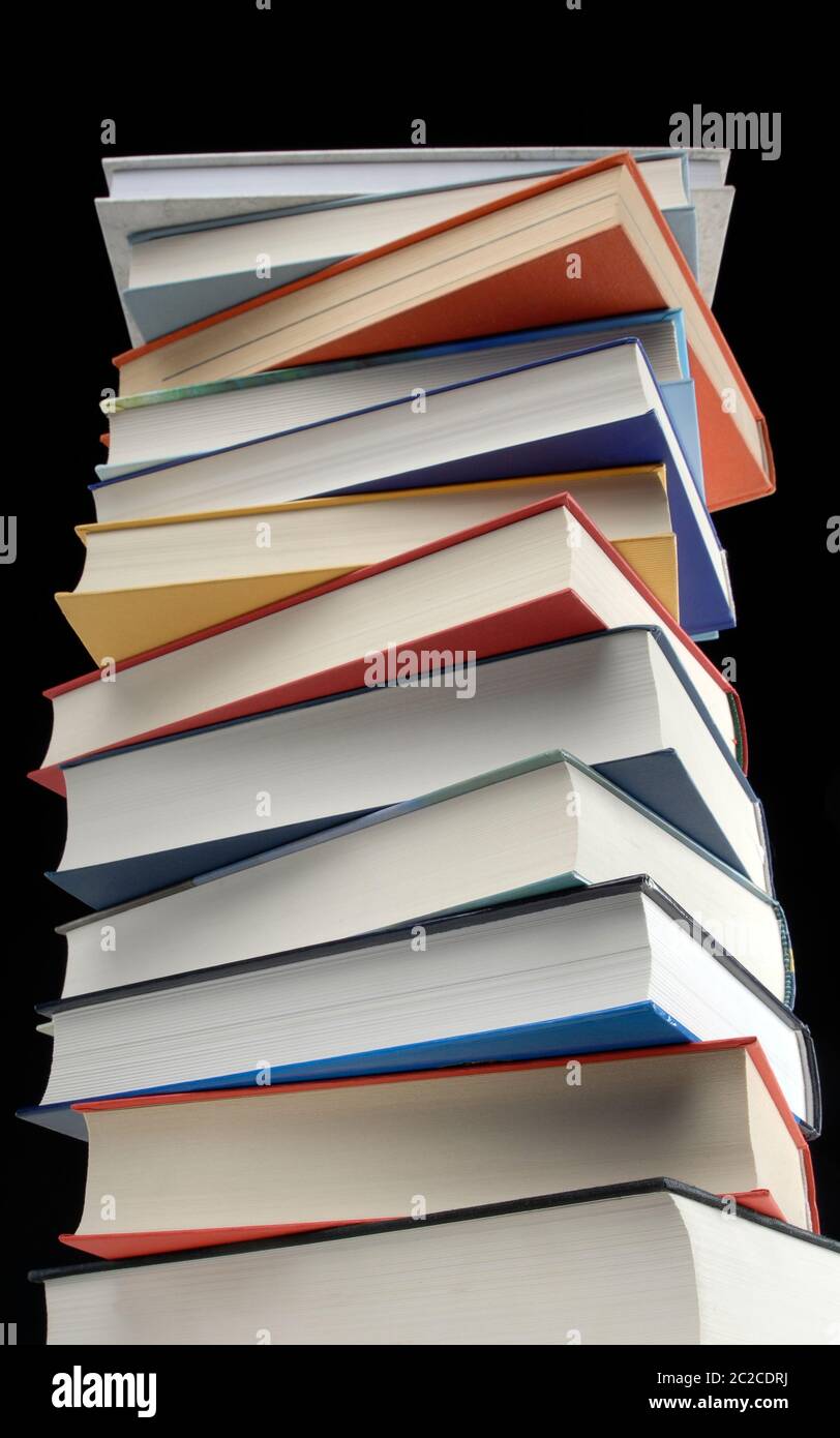 A stack of books in front of black background Stock Photo - Alamy