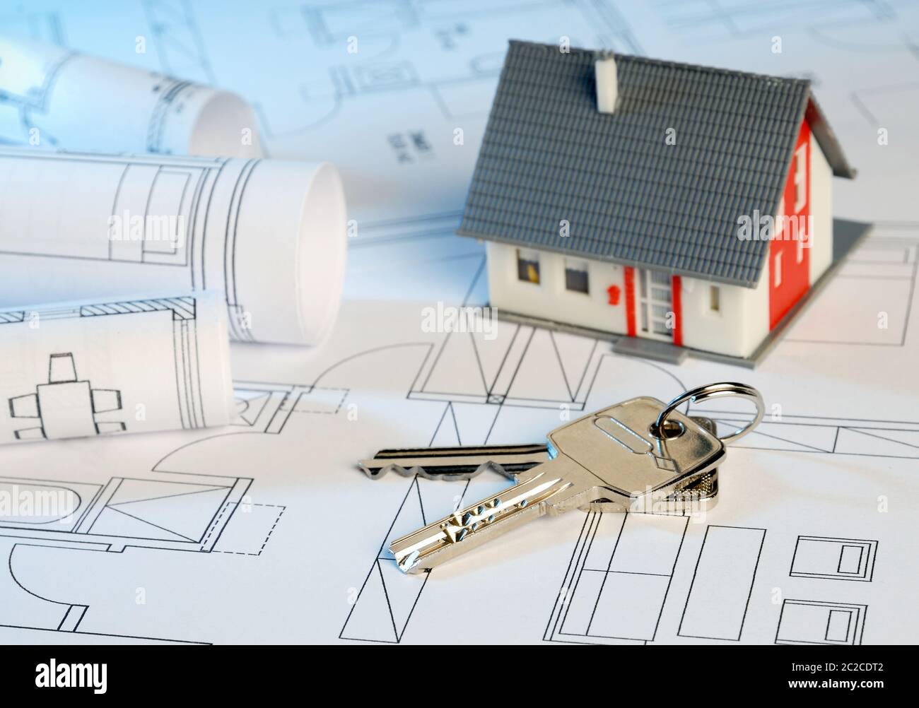 House with blueprints and key Stock Photo - Alamy