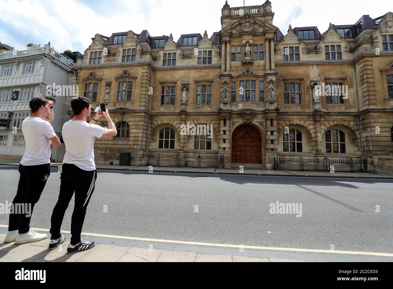 Passers by photograph the controversial statue of colonialist Cecil ...