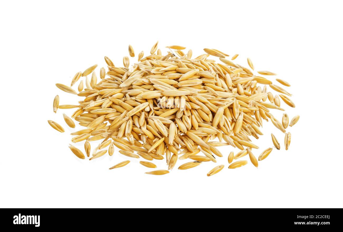 Pile of oat grains isolated on white background Stock Photo - Alamy