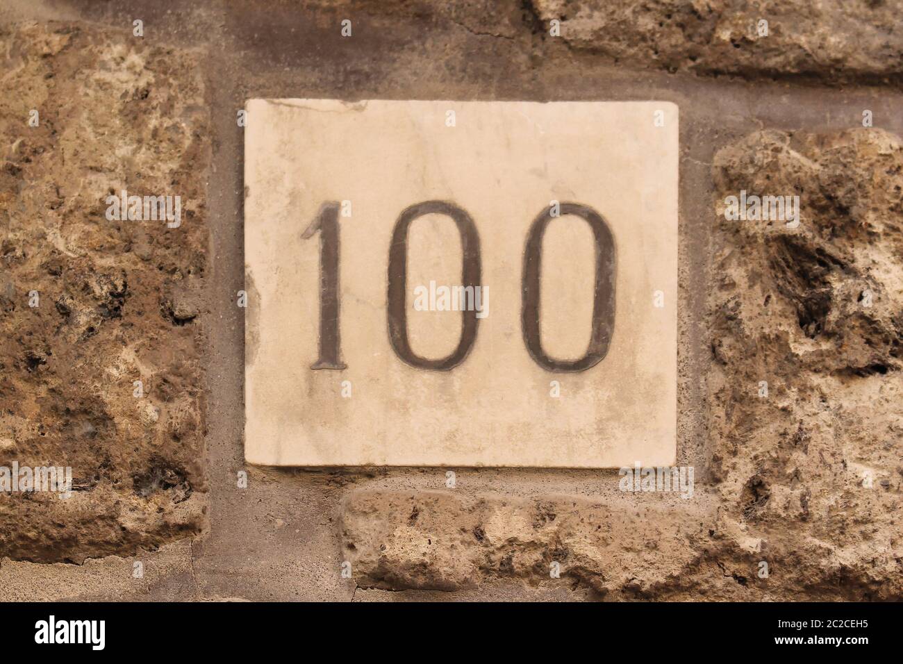 House number plate on residential with stone facade Stock Photo - Alamy
