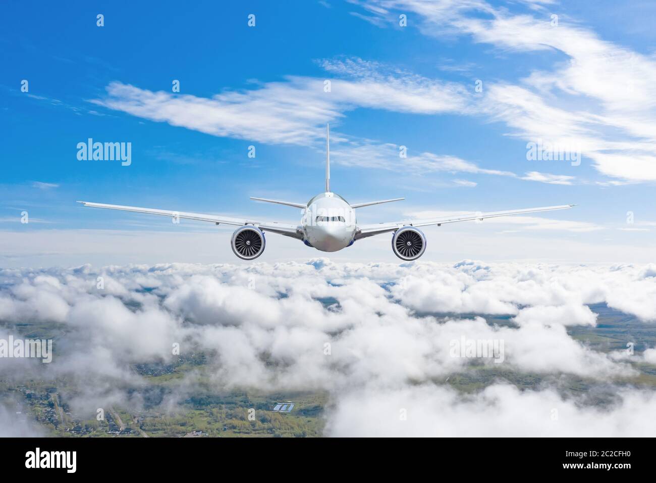 Aircraft fly high in the sky above the summer clouds natural landscape ...