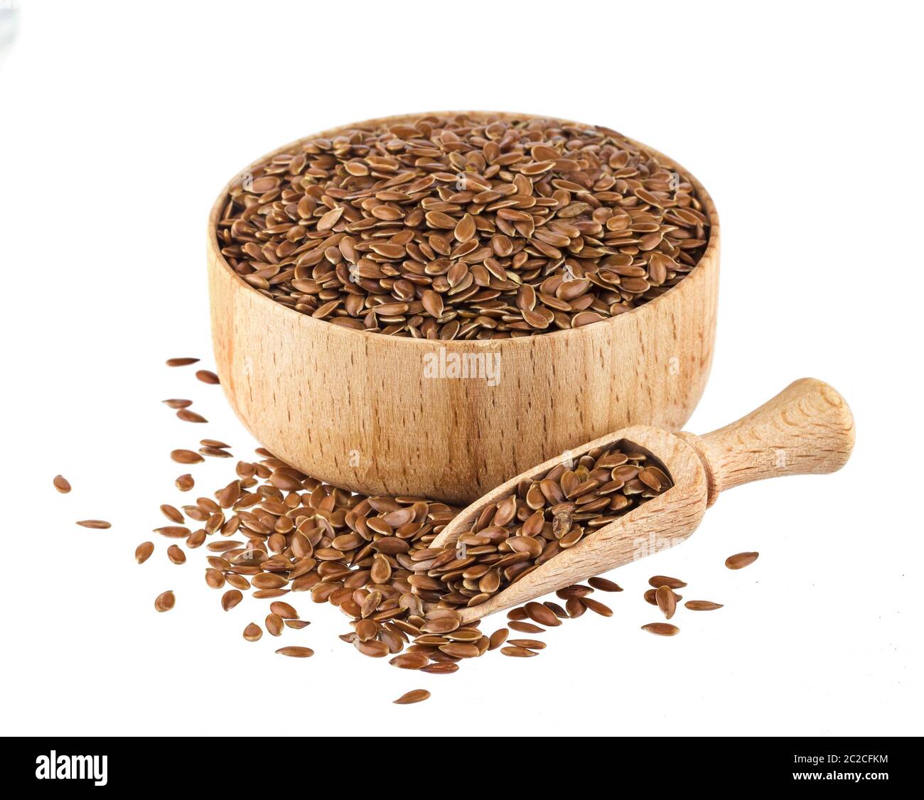 Flax seeds isolated on white background with clipping path, close-up of flaxseed in wooden scoop ...