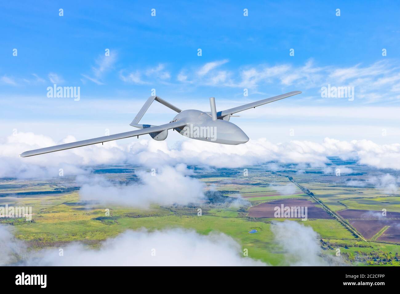 Unmanned aerial vehicles in the sky flying clouds over the territory ...