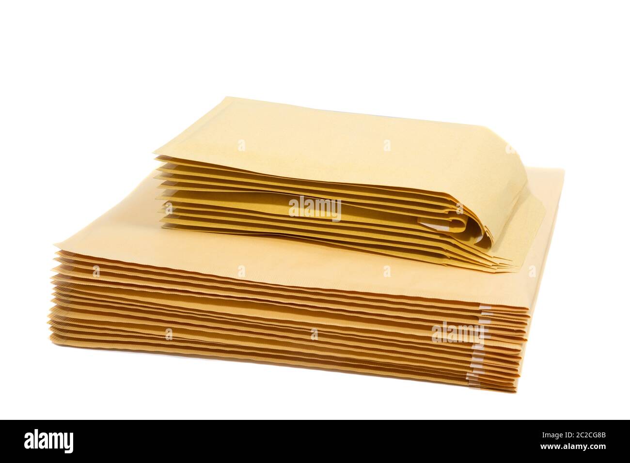 Stack of padded mailing envelopes isolated against a white background ...