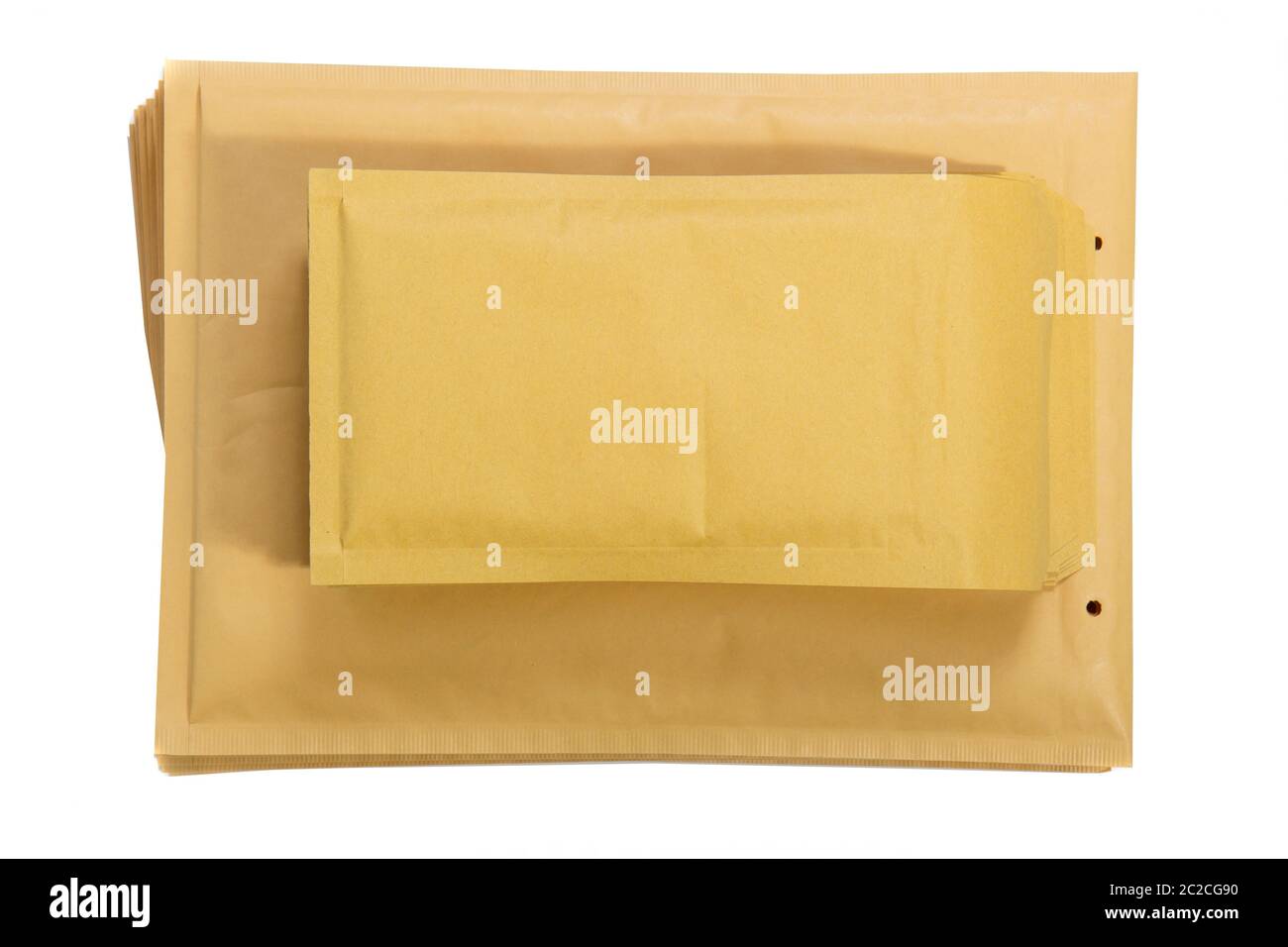 Stack of padded mailing envelopes isolated against a white background ...