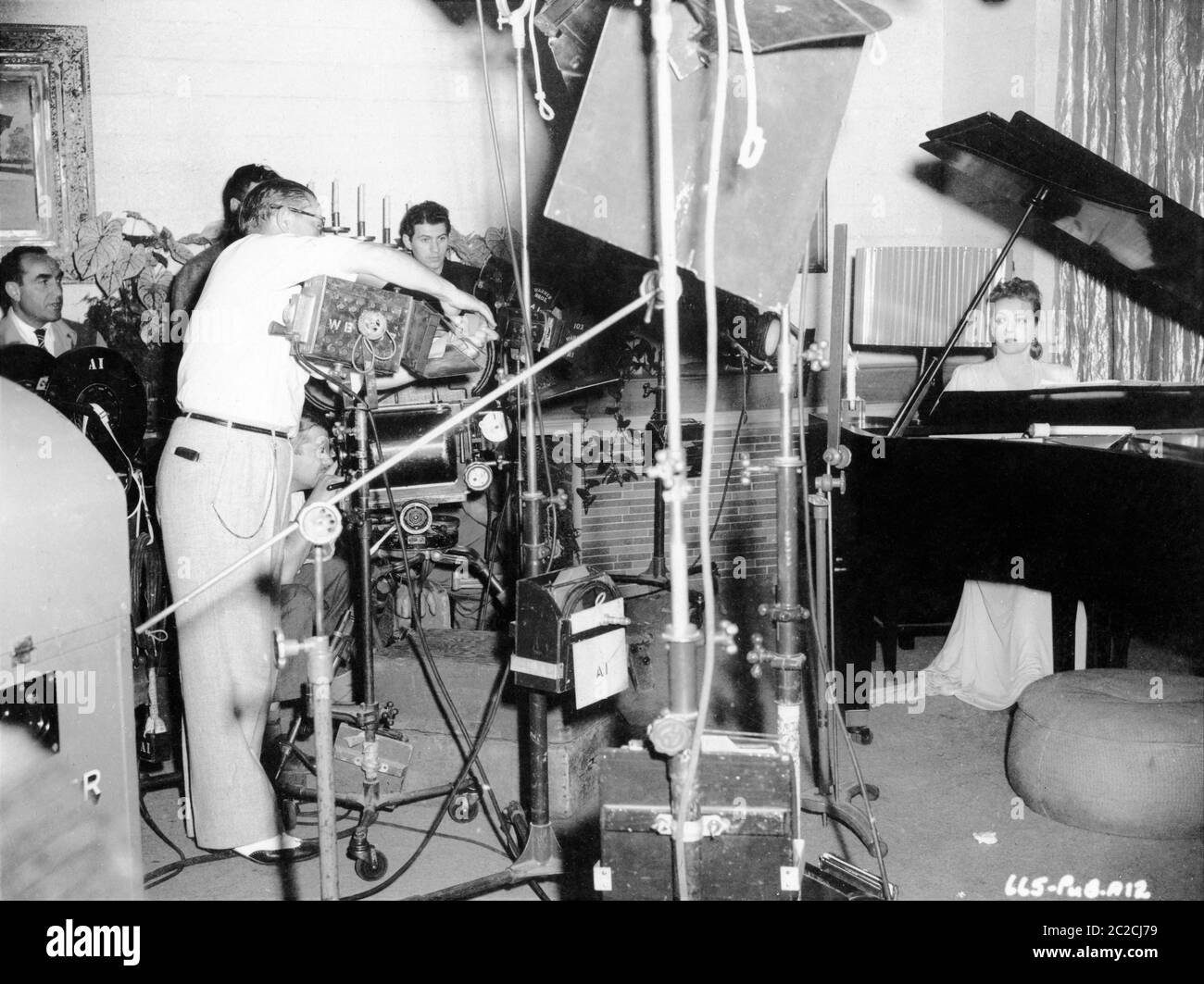 Director IRVING RAPPER (far left) and BETTE DAVIS with film crew on set ...
