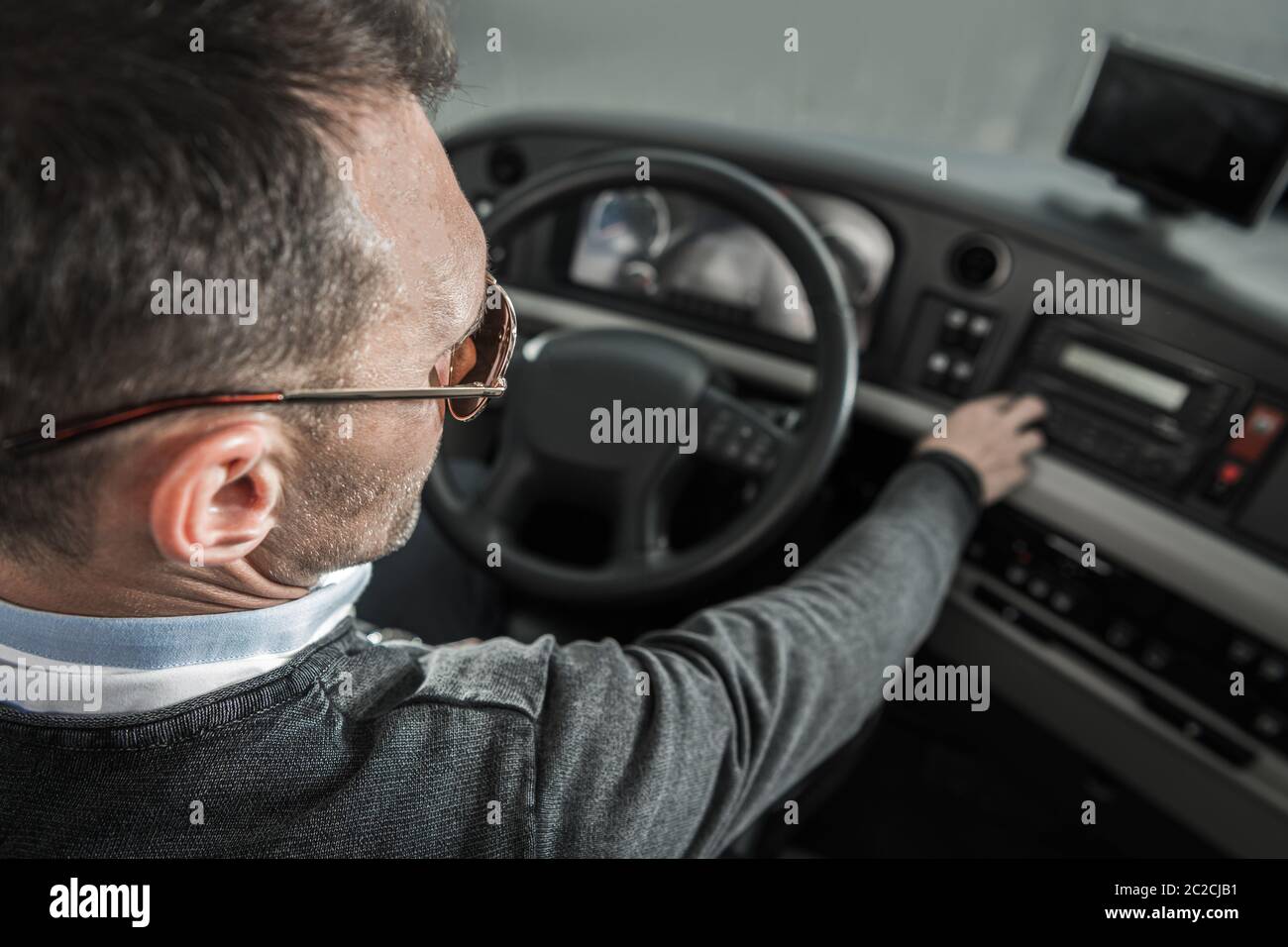 Caucasian Coach Bus Driver in HIs 40s and Vehicle Cockpit. Bus Interior ...