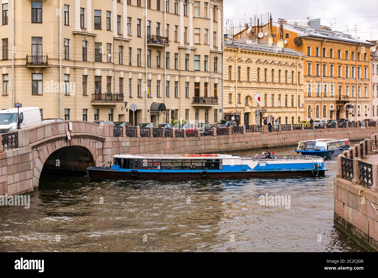 Tourist river cruise boats entering Winter canal, Moyka River, St ...