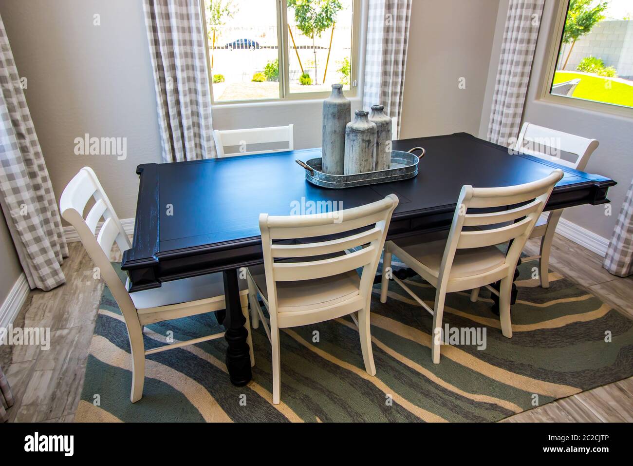 Modern Wooden Dining Room Table And Chairs With Centerpiece Stock Photo ...