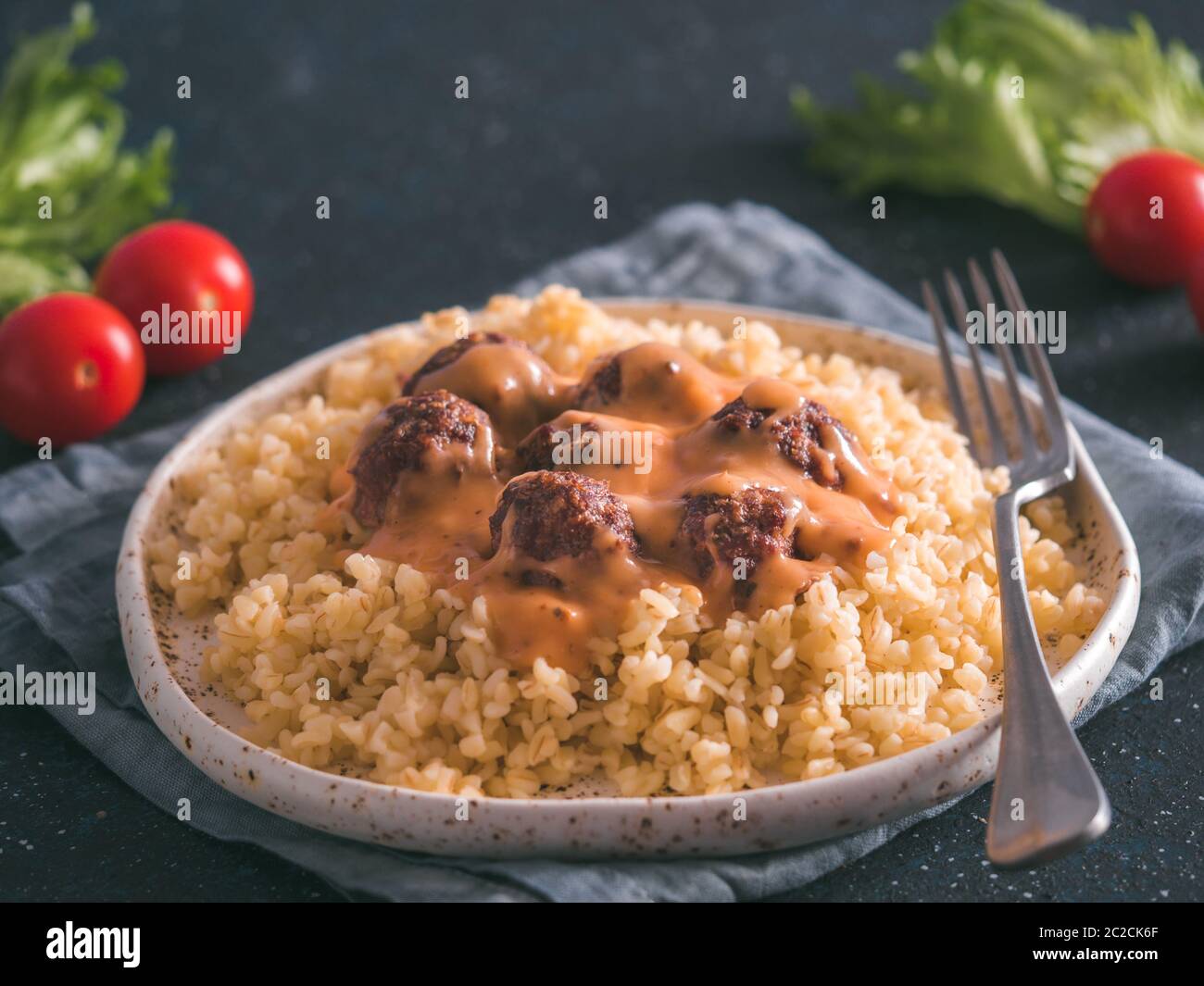 Bulgur and meatball in plate Stock Photo - Alamy