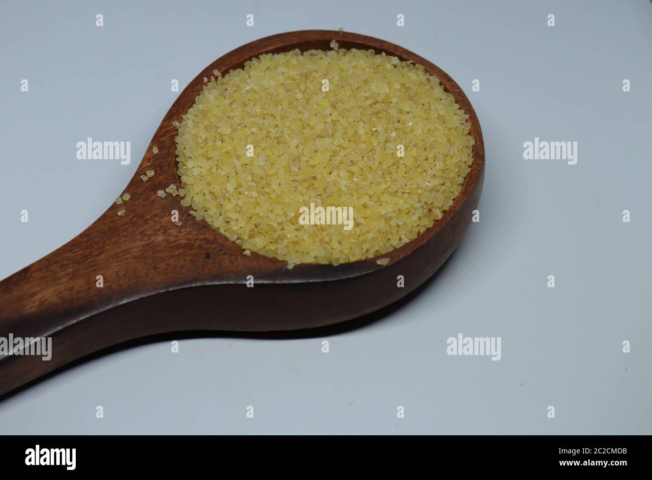 Raw Semolina flour or Rava powder isolated in white background Stock ...