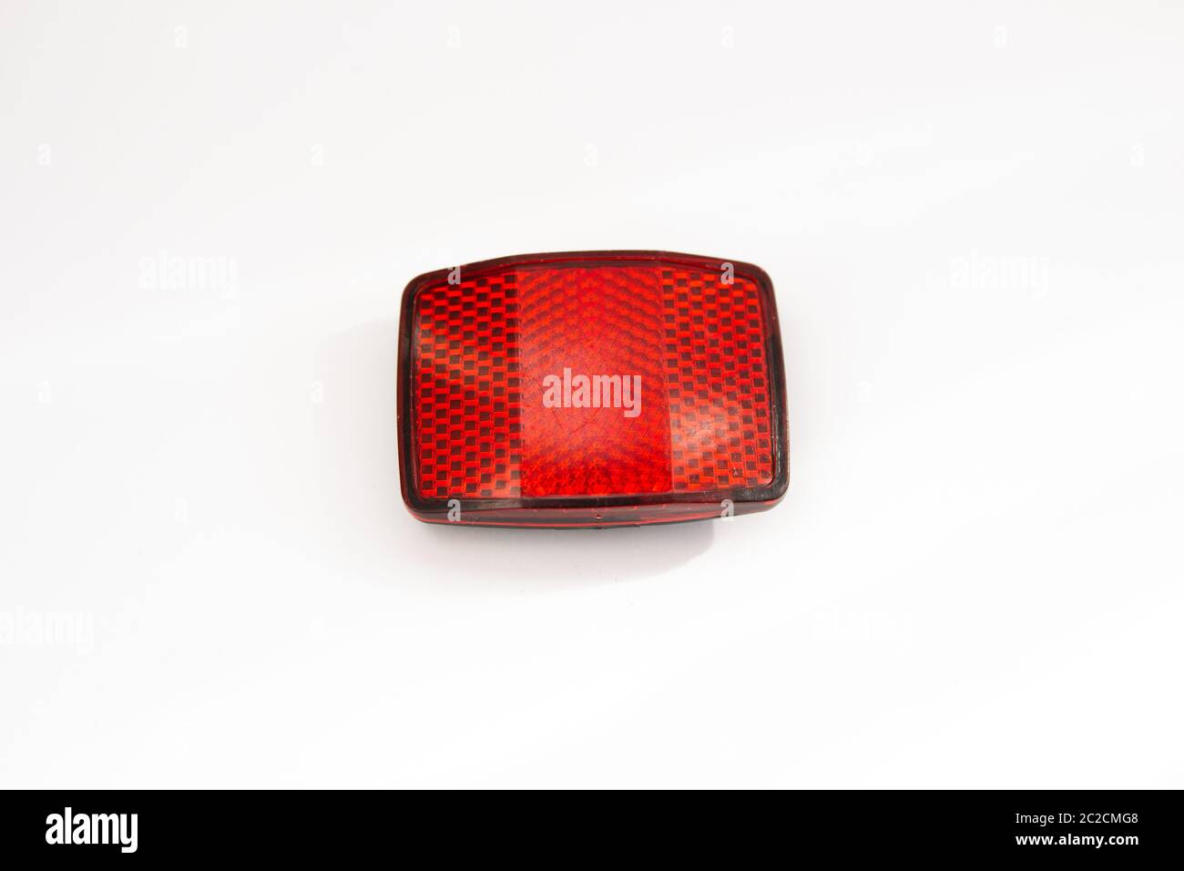 red reflective bicycle on a white background Stock Photo - Alamy