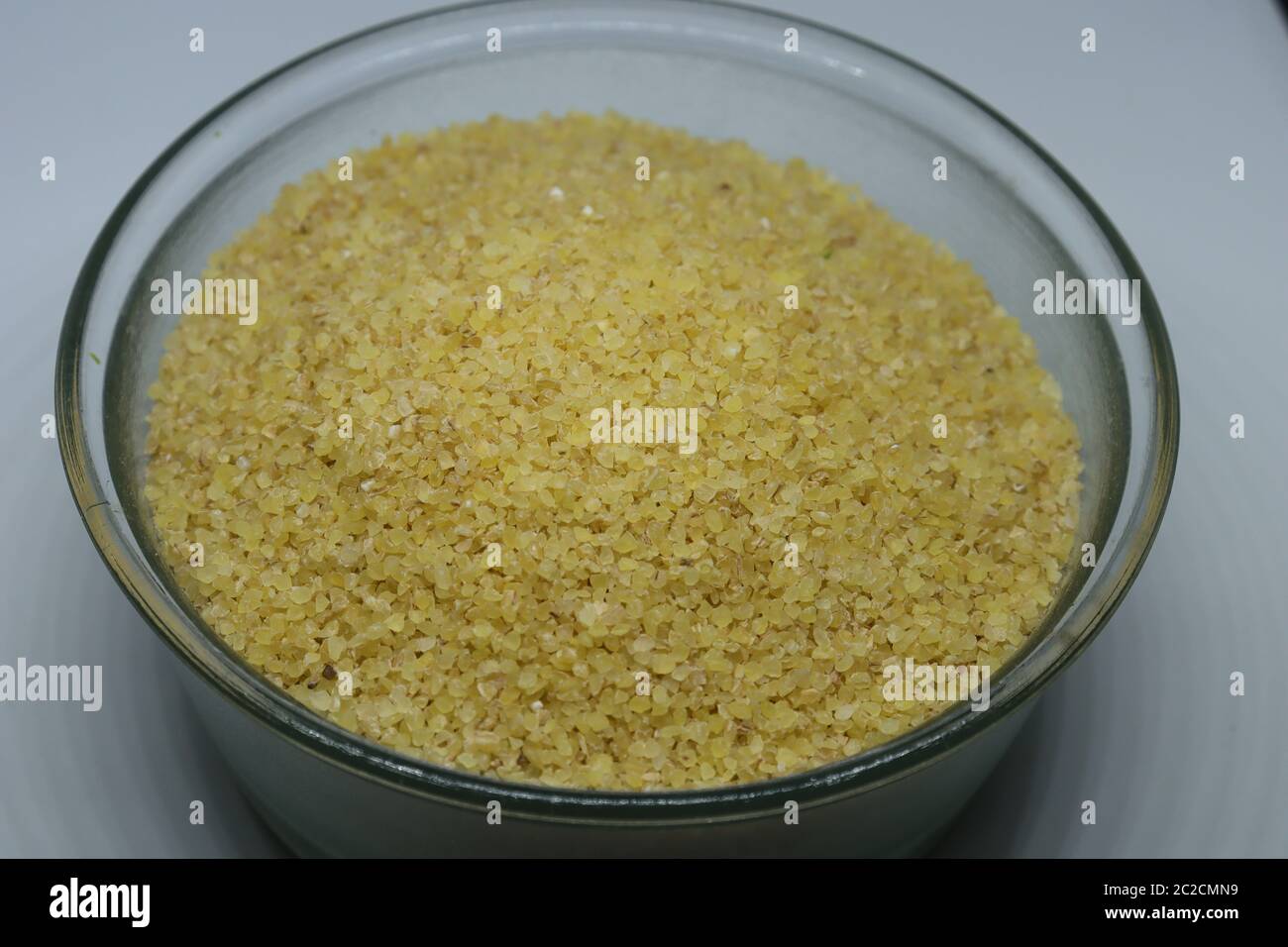 Raw Semolina flour or Rava powder isolated in white background Stock ...